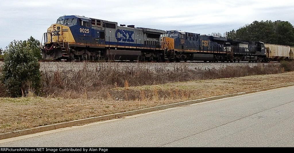 CSX C40-9W 9025, ES44AC-H 3004, and NS C40-9W 9455